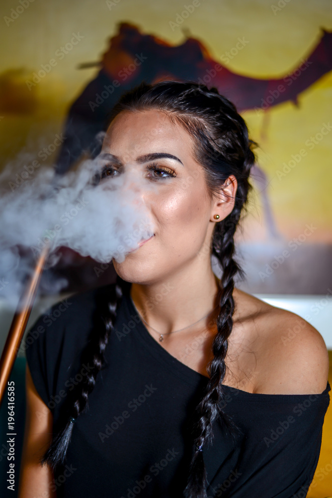 Young hot girl smoking shisha Stock Photo | Adobe Stock