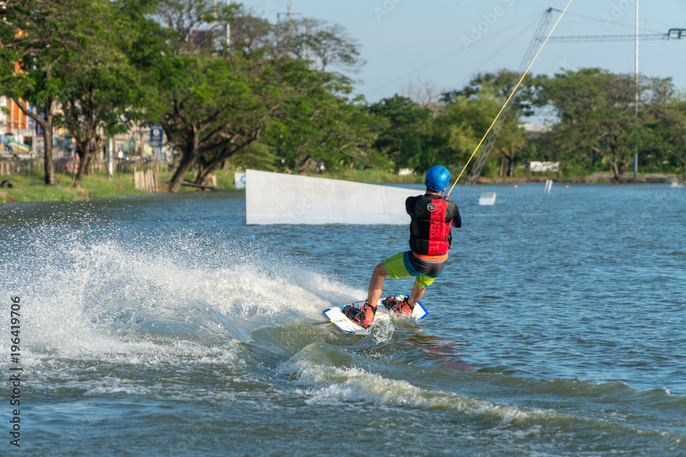 2017, April 30, Bangkok, Thailand: Man wake boarding on a lake with ...