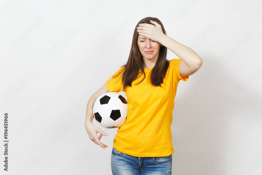 Pretty European young sad upset woman, football fan or player in yellow ...