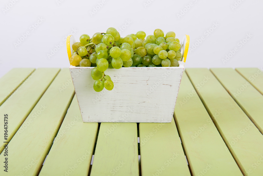 Grapes on the table. A bunch of ripe grapes in a basket. Picnic ...