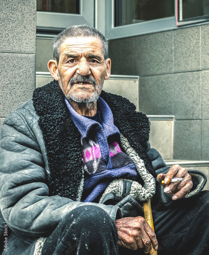 Homeless man, Old poor and homeless gypsy man sitting on the stairs on ...
