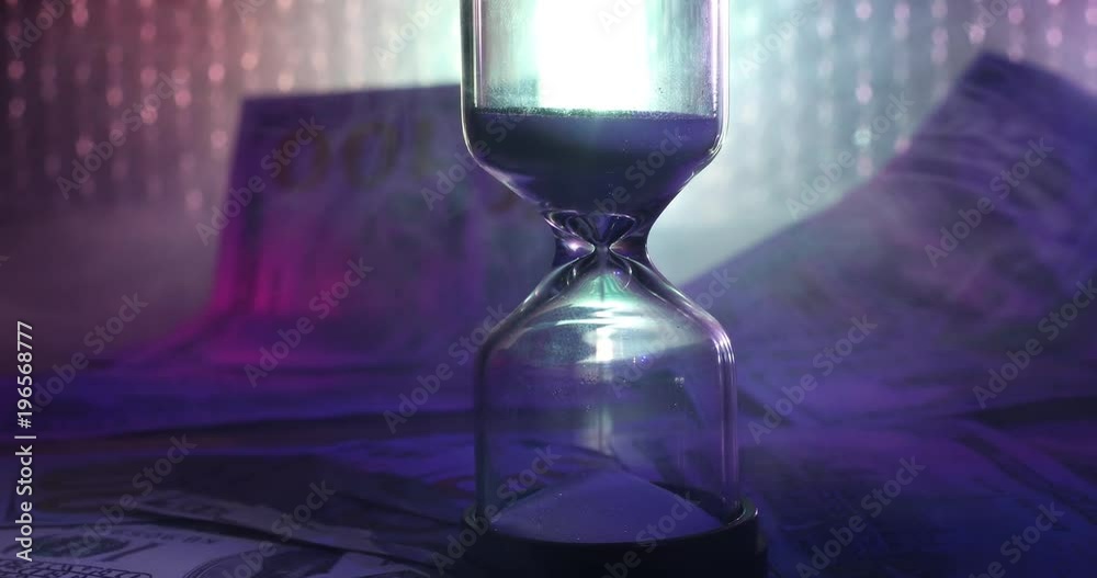 Vidéo Stock Time concept. Silhouette of Hourglass clock on dark toned ...