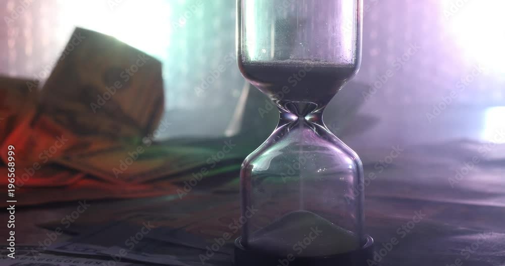 Time concept. Silhouette of Hourglass clock on dark toned backlight ...