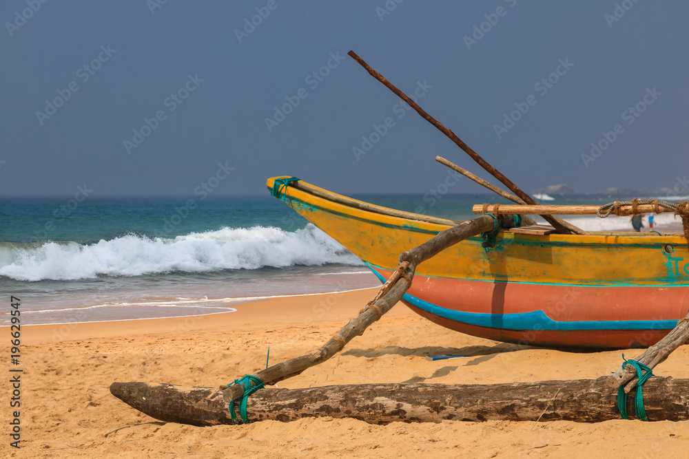 Buntes Fischerboot am Strand von Sri Lanka Stock Photo | Adobe Stock