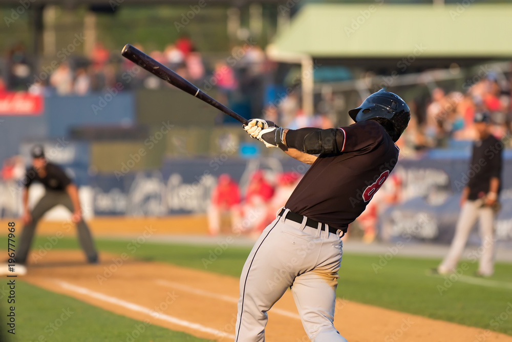baseball player swinging at a pitch Stock Photo | Adobe Stock