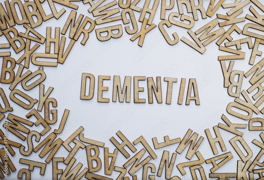 Dementia word spelled with wooden letters against confusion of jumbled ...