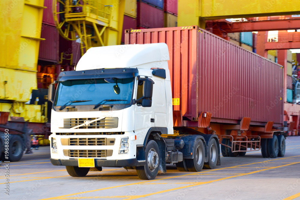 Heavy Duty Truck Pick Up Shipping Container At Port Logistics Concept