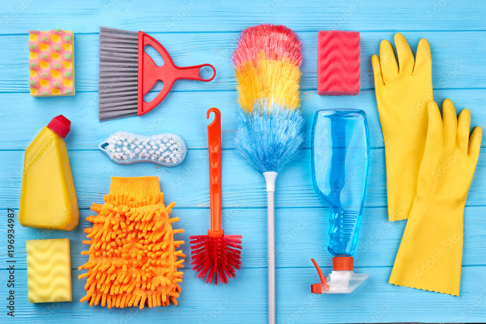 Cleaning stuff on blue wooden background. Set of cleaning products ...