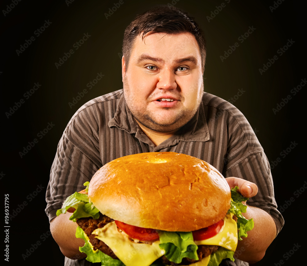 Fotografia do Stock: Man eating fast food hamberger. Fat person made ...