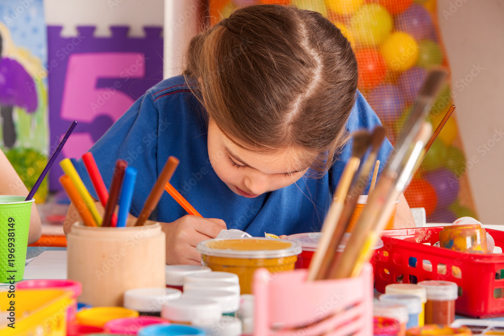 Small students painting in art school class. Child drawing by paints on ...