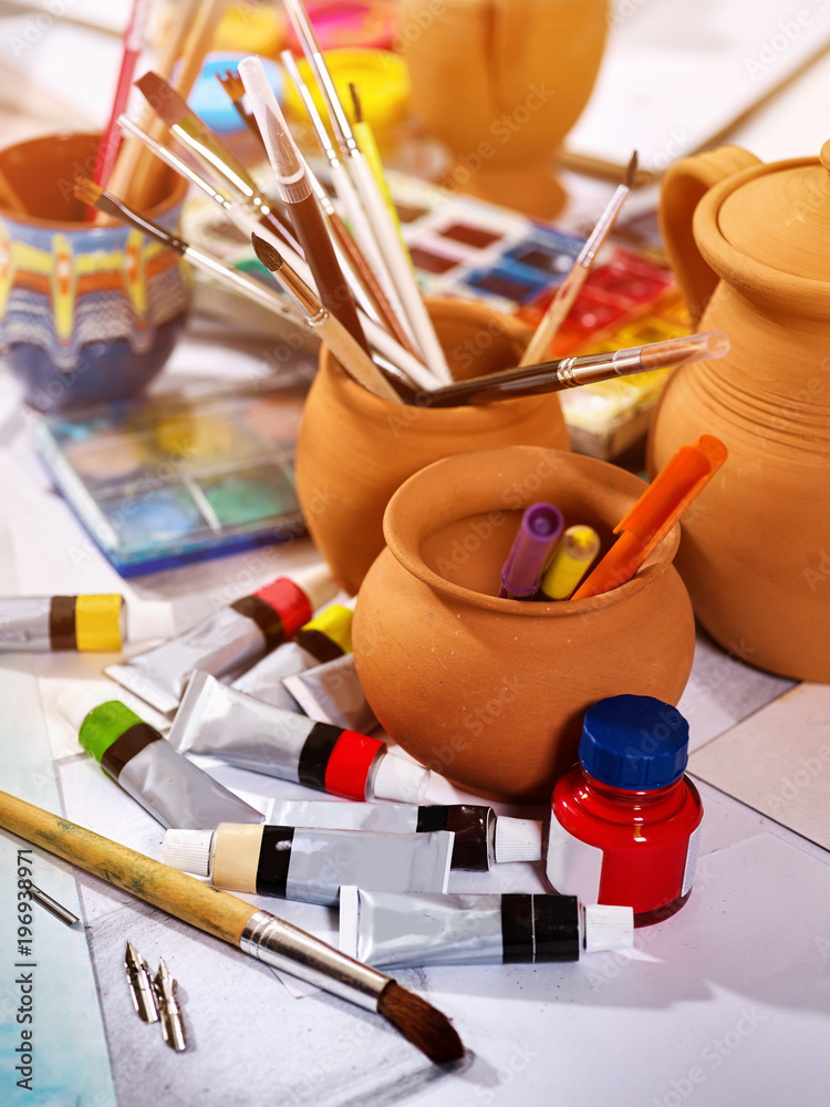 Authentic paint brushes still life on table in art class school as ...
