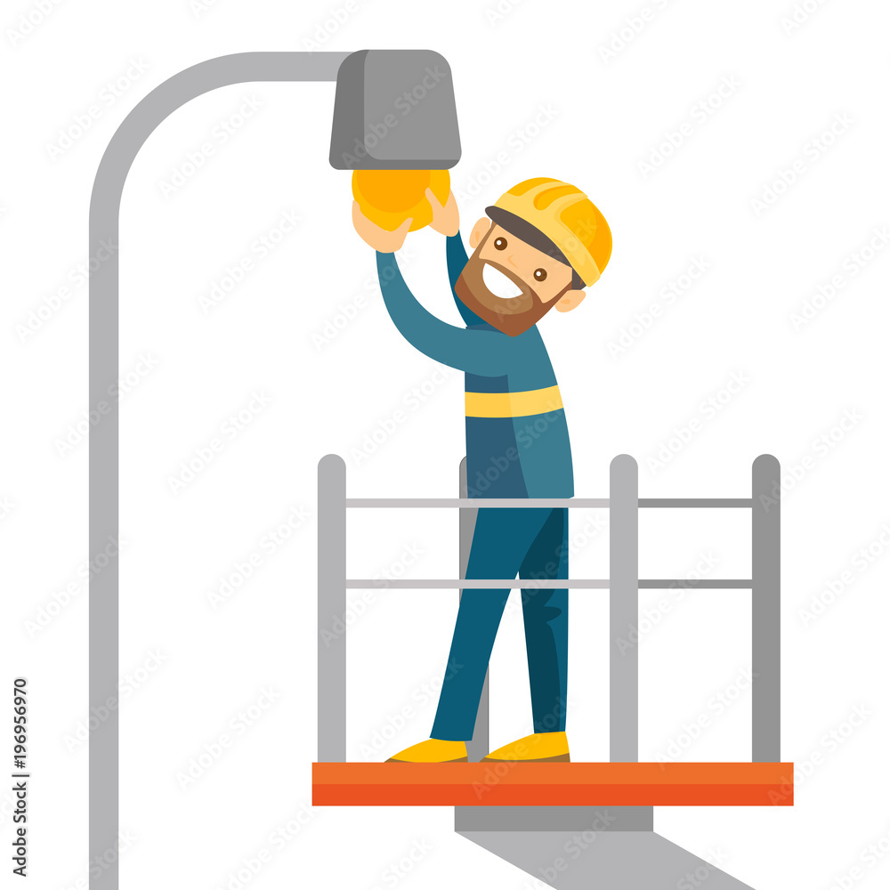 Caucasian white electrician in hard hat working on lamp post and ...