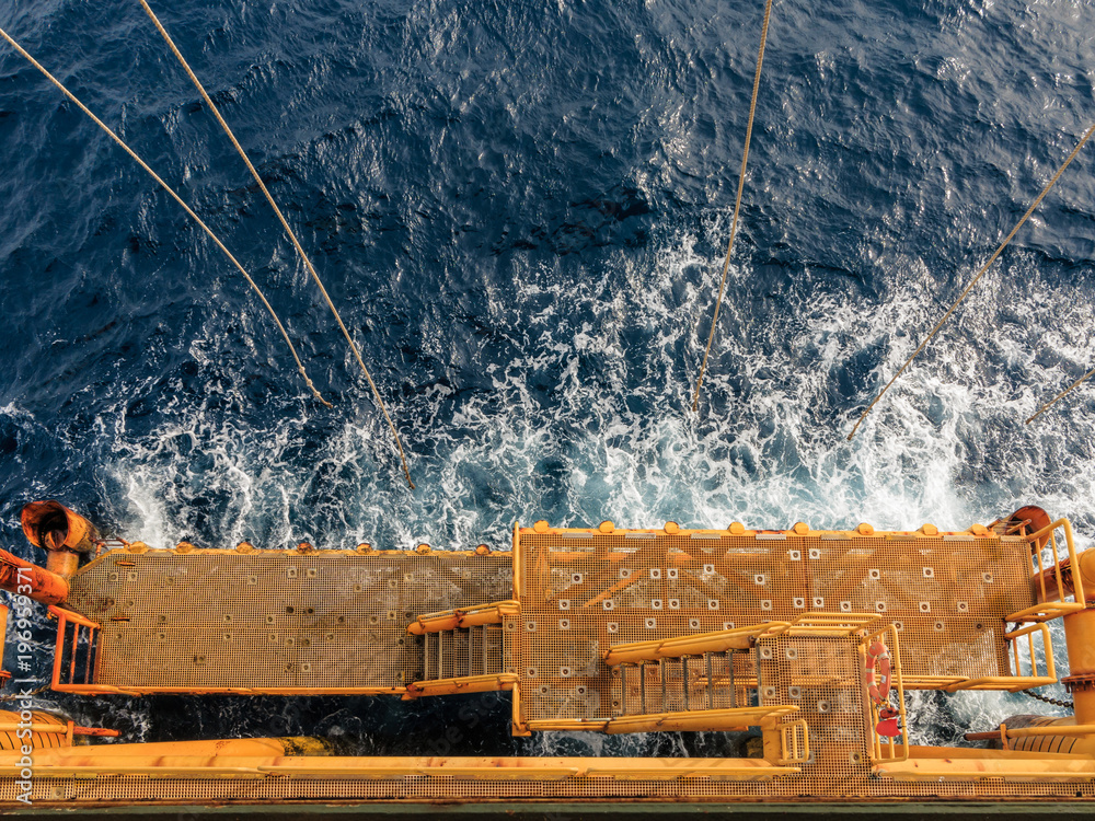 Offshore oil and gas platform at boat landing while the high wave in ...