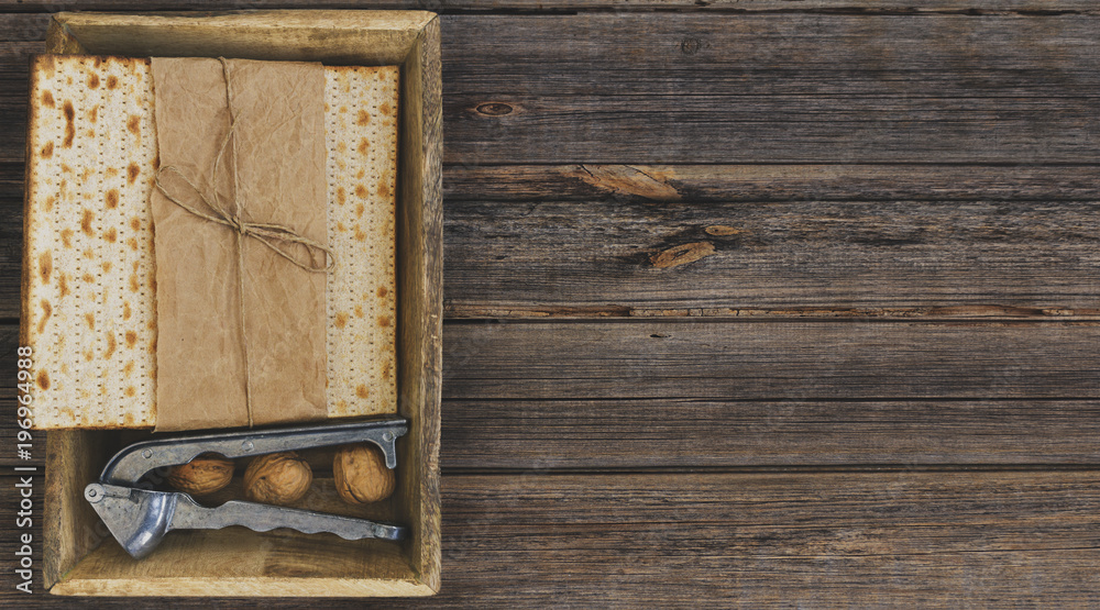 Pack of matzah or matza on a vintage wood background presented as a ...