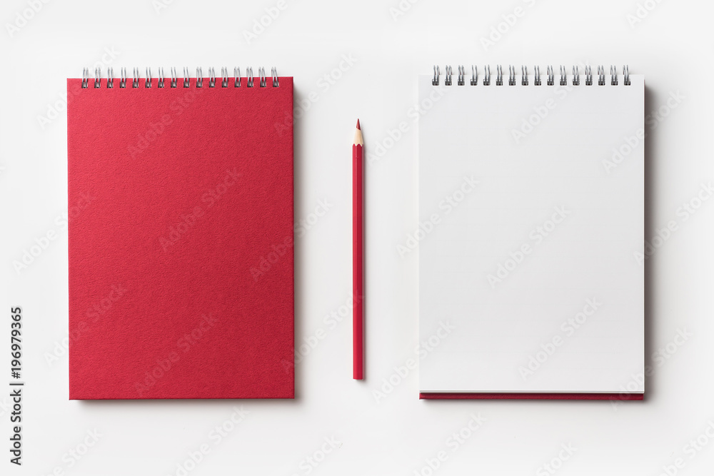 Design concept - Top view of red spiral notebook and color pencil ...