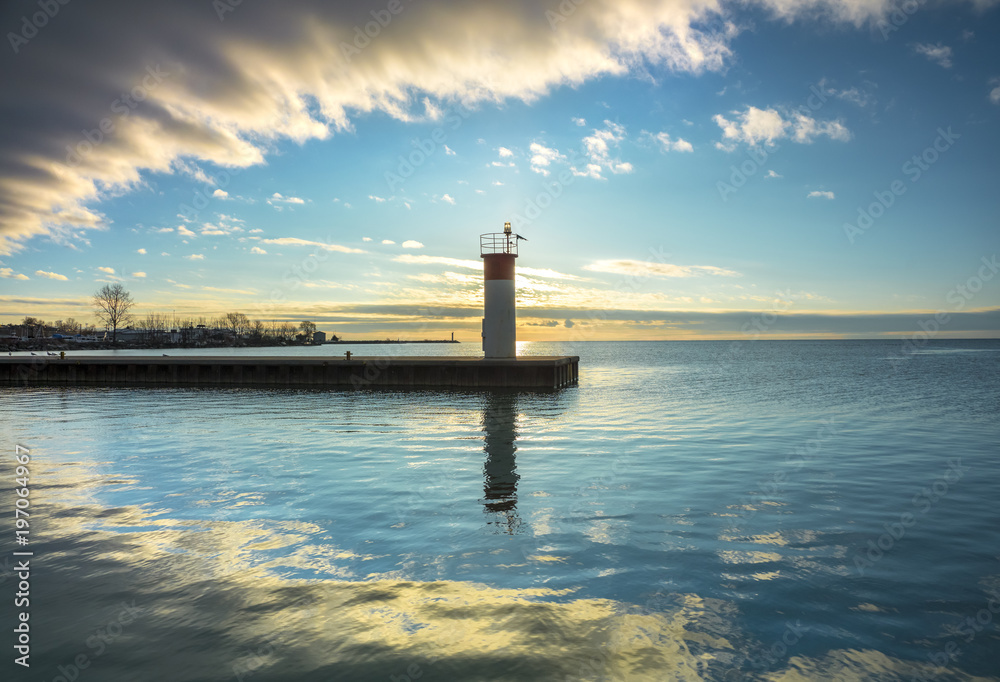 Photo & Art Print Lighthouse and harbour emerging safely from clearing ...