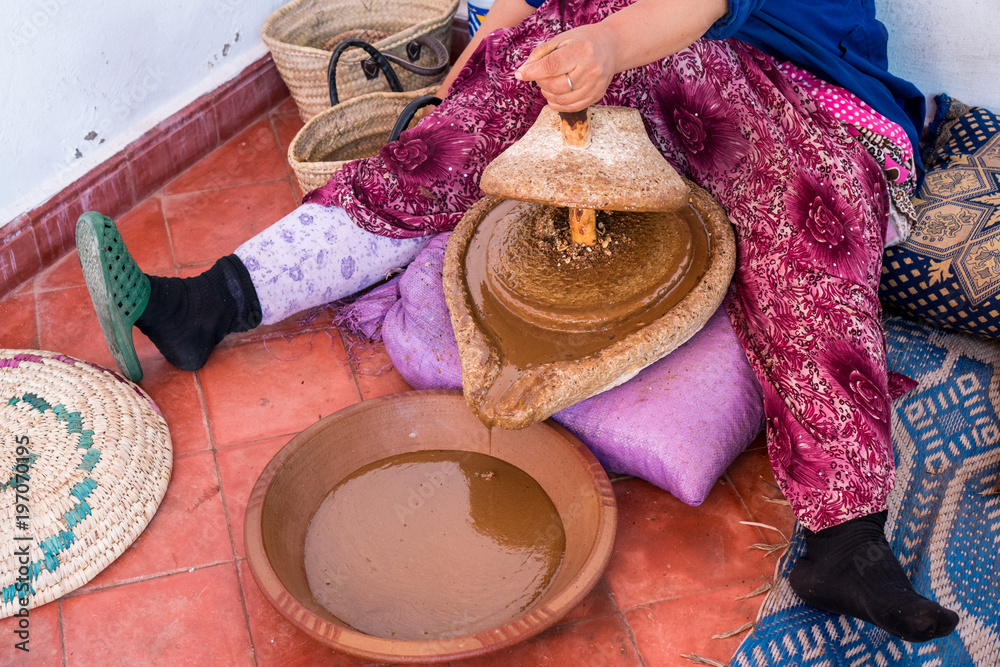 Muslim women making argan oil in traditional way in Morocco ...