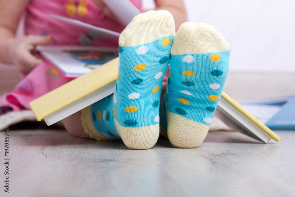 child's feet reading books Stock Photo | Adobe Stock