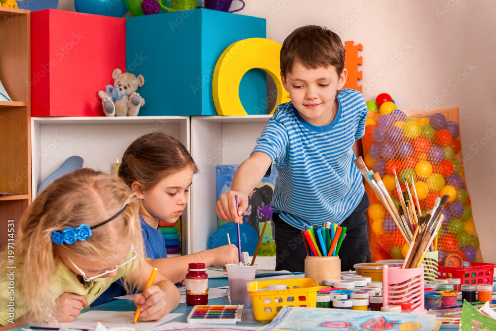 Small students painting in art school class. Children boy and girl ...