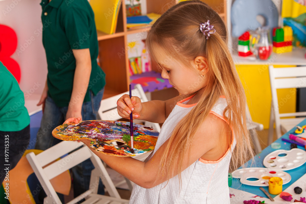 Small students painting in art school class. Child drawing by paints on ...