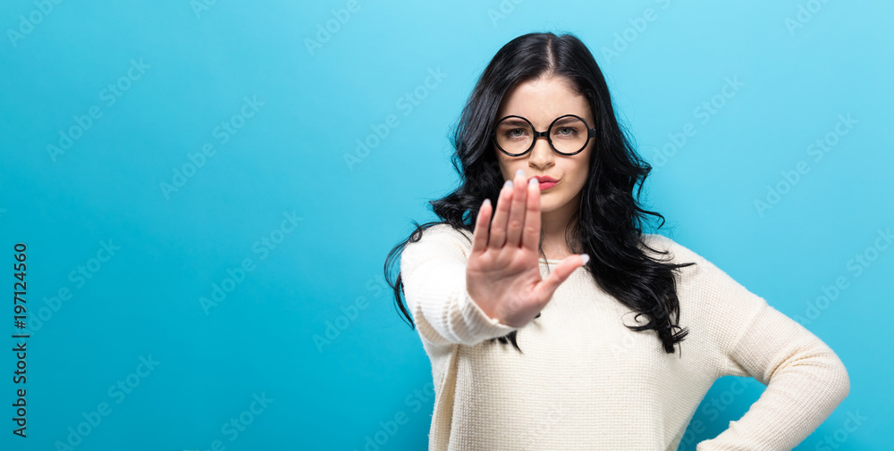 Young woman making a rejection pose a solid background Stock Photo ...