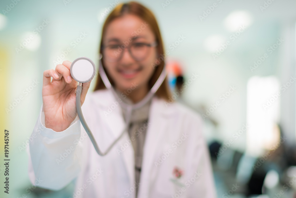 Doctor with stethoscope standing at hospitol, Stock Photo | Adobe Stock