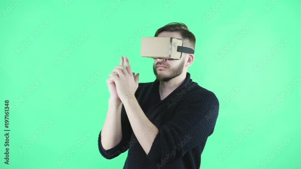 Male player wear wearable oculus glasses and going to playing. One ...