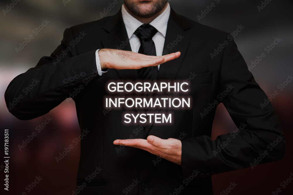 Geographic information system (GIS) concept text between hands of the ...