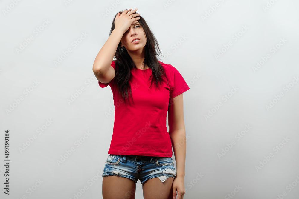 Young, beautiful girl makes a gesture Facepalm. Isolated on a light ...