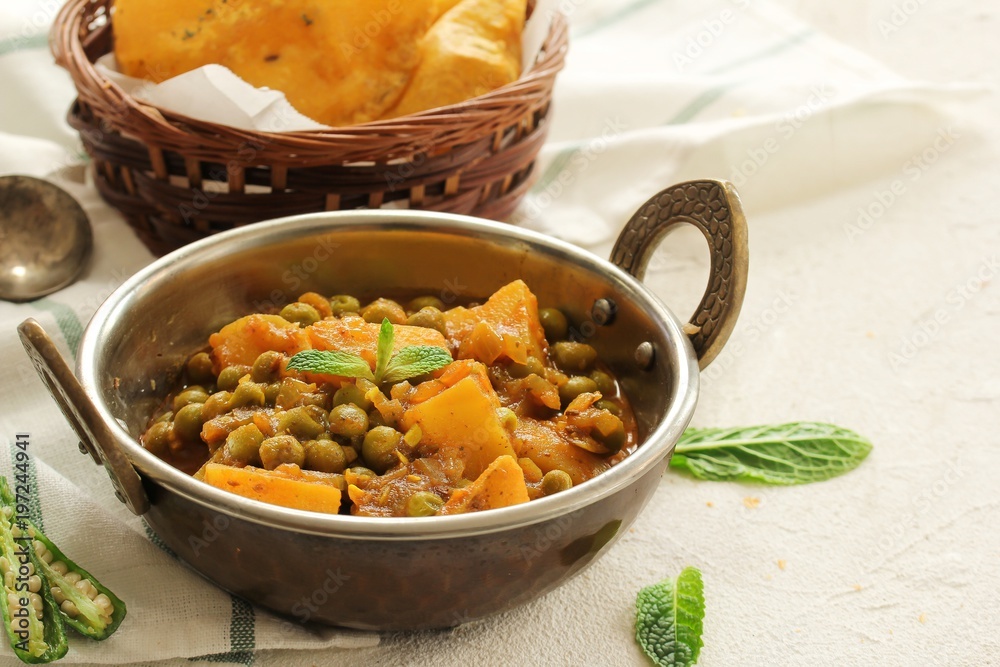 Alu Matar ( Aloo Mutter) served with Masala Puri or Poori Stock Photo ...