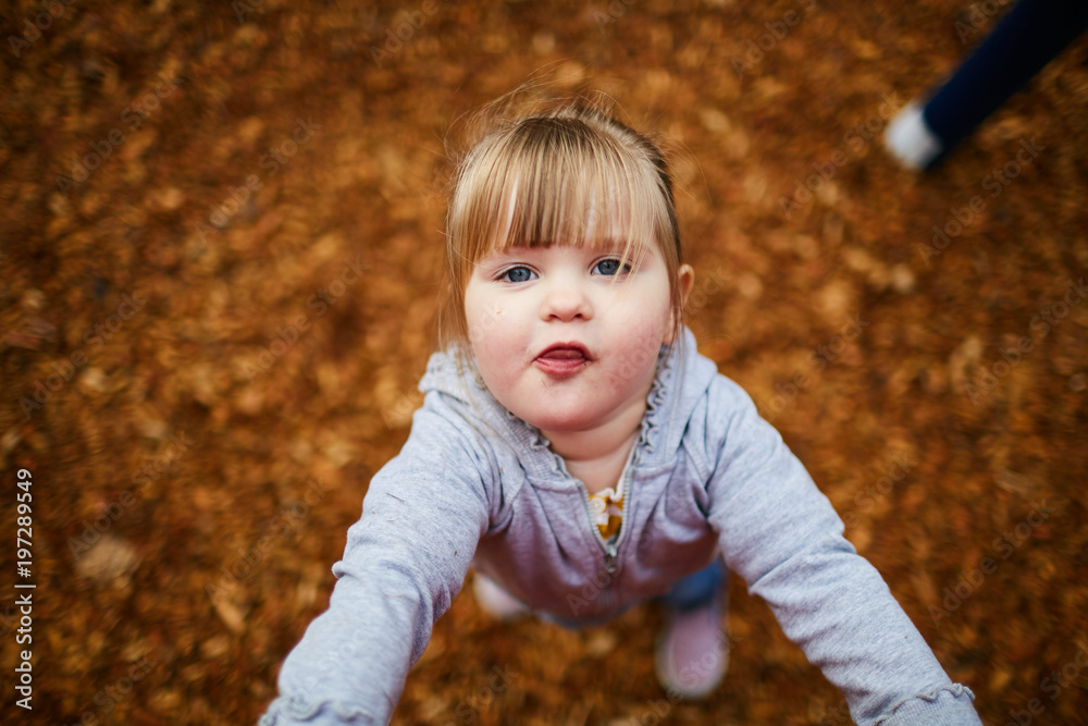 young girl wanting to be picked up Stock Photo | Adobe Stock
