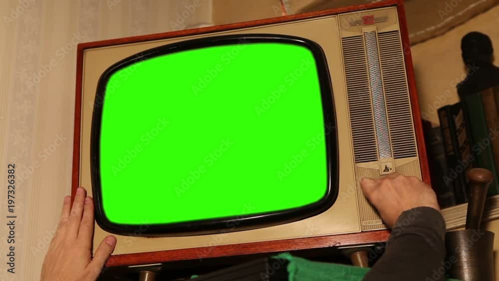 Old TV with green screen, retro TV in an old interior with a green ...