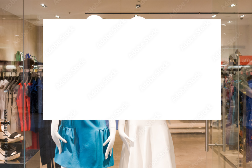Mock up. Large blank banner in the showcase of clothing store in ...
