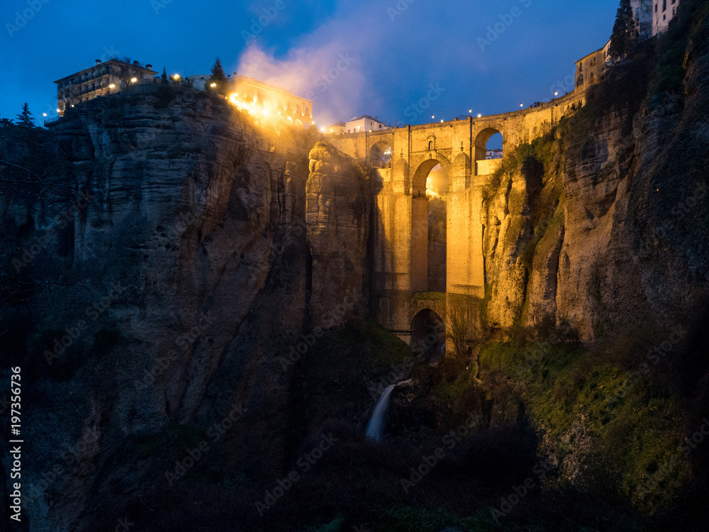 Medieval bridge in night. Ronda, Spain. Famous bridge also known as ...