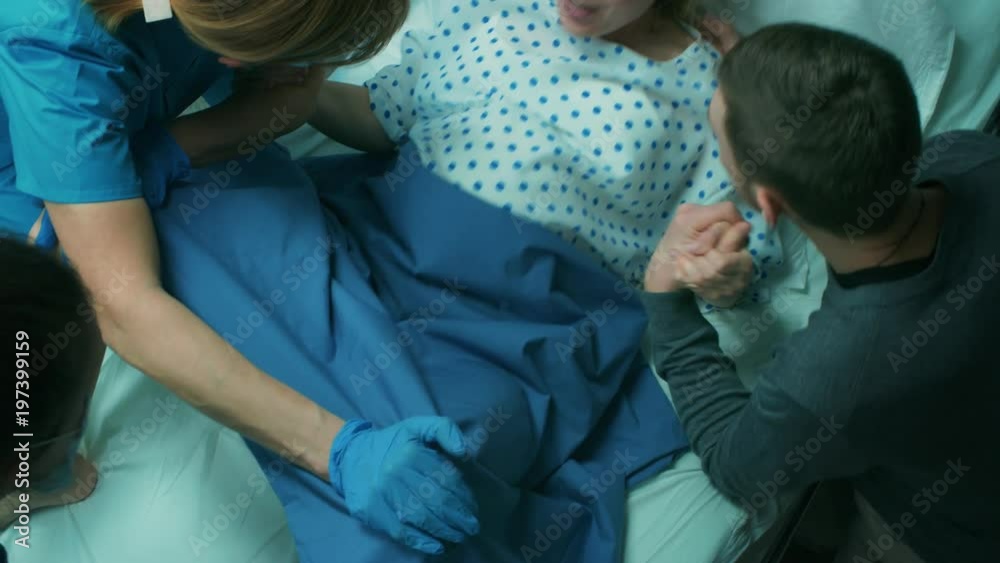 In the Hospital Woman in Labor Pushes to Give Birth, Obstetricians ...