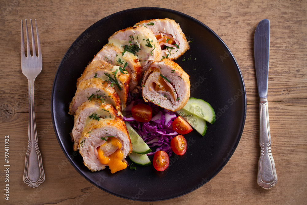 Chicken Cordon Bleu. Chicken breast wraps with ham and cheese, overhead ...