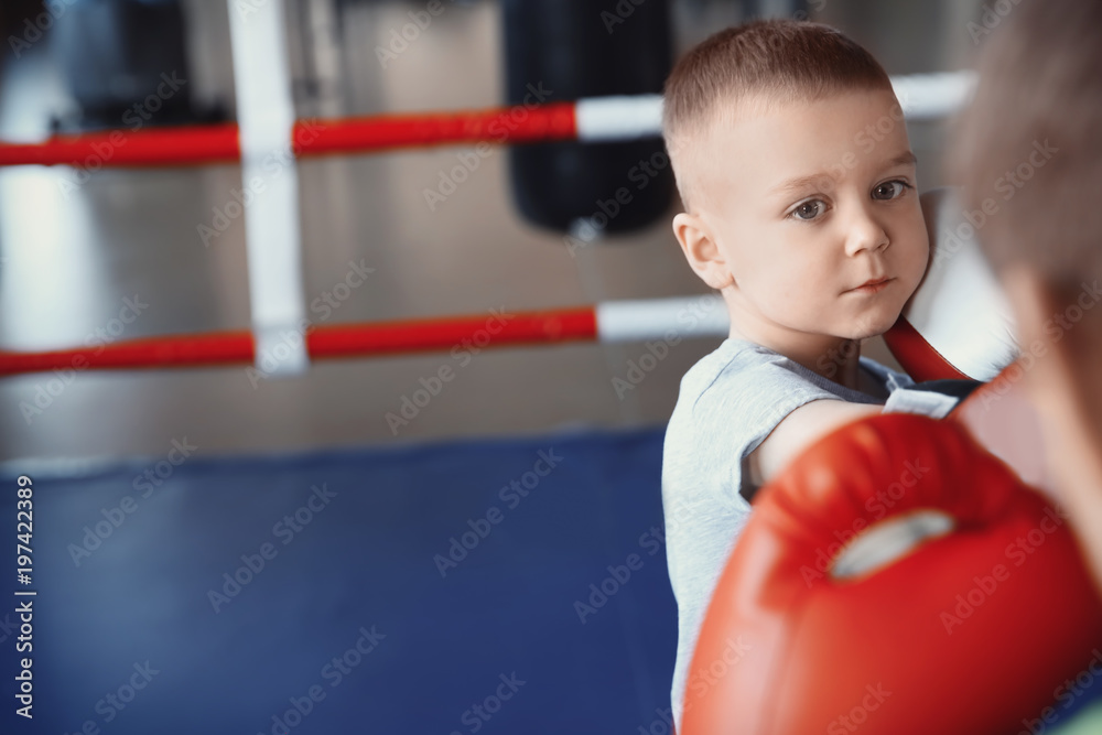 Little boy training with coach in boxing ring Stock Photo | Adobe Stock