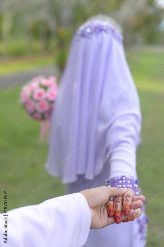 Muslim Wedding Couple Holding Hands