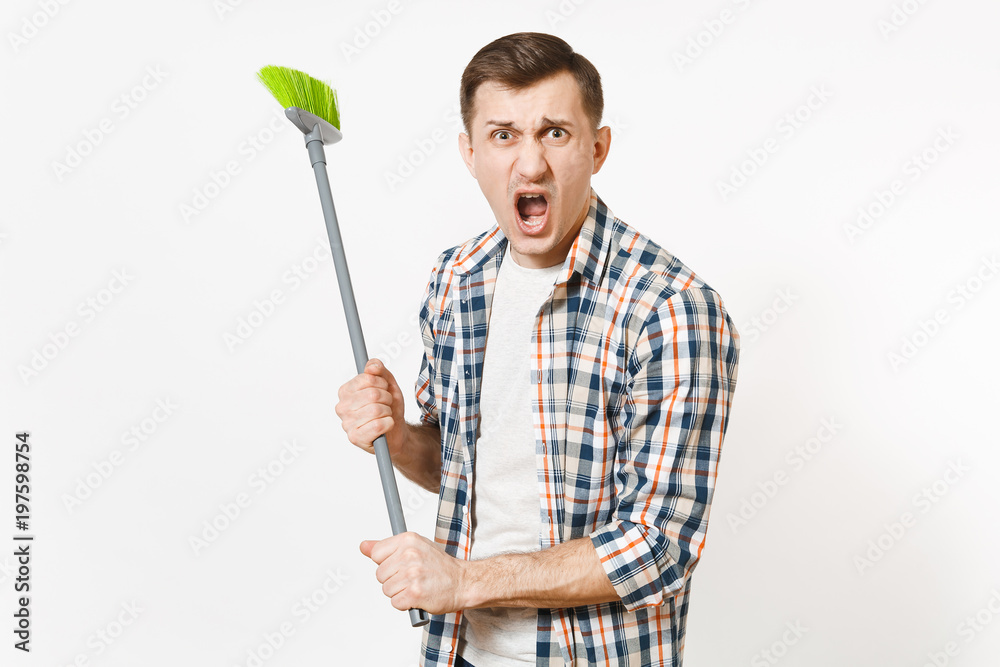 Young combative angry housekeeper man in checkered shirt holding and ...