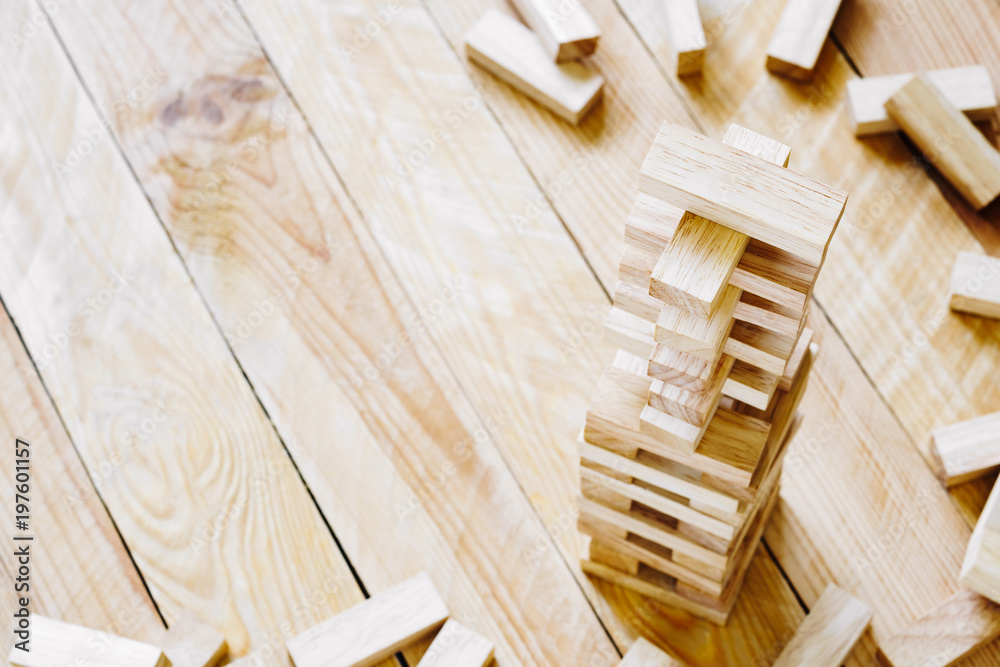 Wooden building blocks tower on wood background with copy space. Wood ...