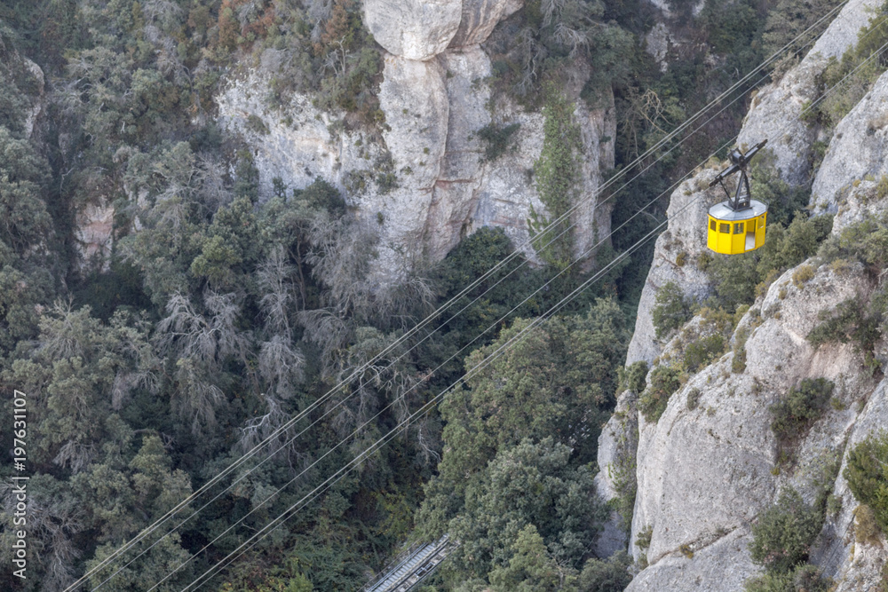 Rock formations and cabin of Aeri de Montserrat, aerial cable car with ...