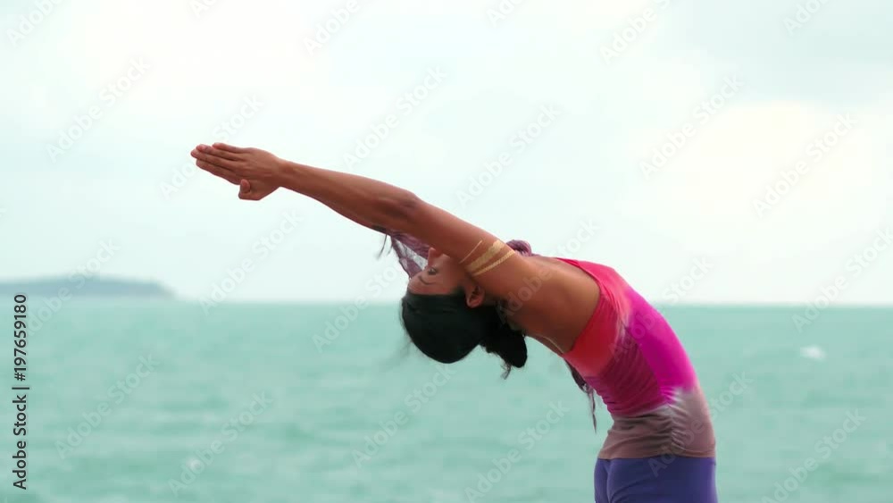 Asian Woman In Yoga Pose Surya Namaskar And Prayer Pose On Beach