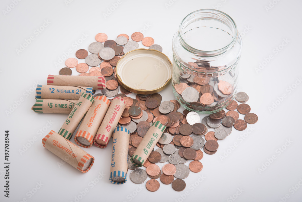 rolled coins and jar Stock Photo | Adobe Stock