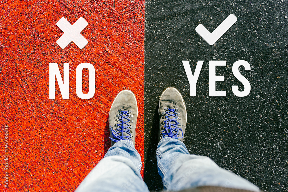 Concept of facing a crucial decision about yes or no shown by shoes on ...