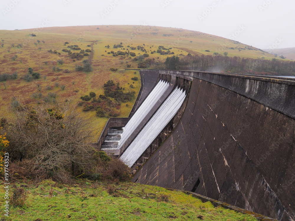 Water flowing over Meldon Dam with wind whipping up spray, Meldon ...