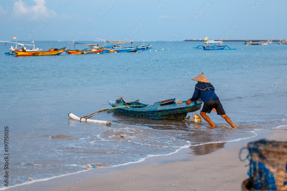 Fisherman pushing their boat, going fishing in the early morning in ...
