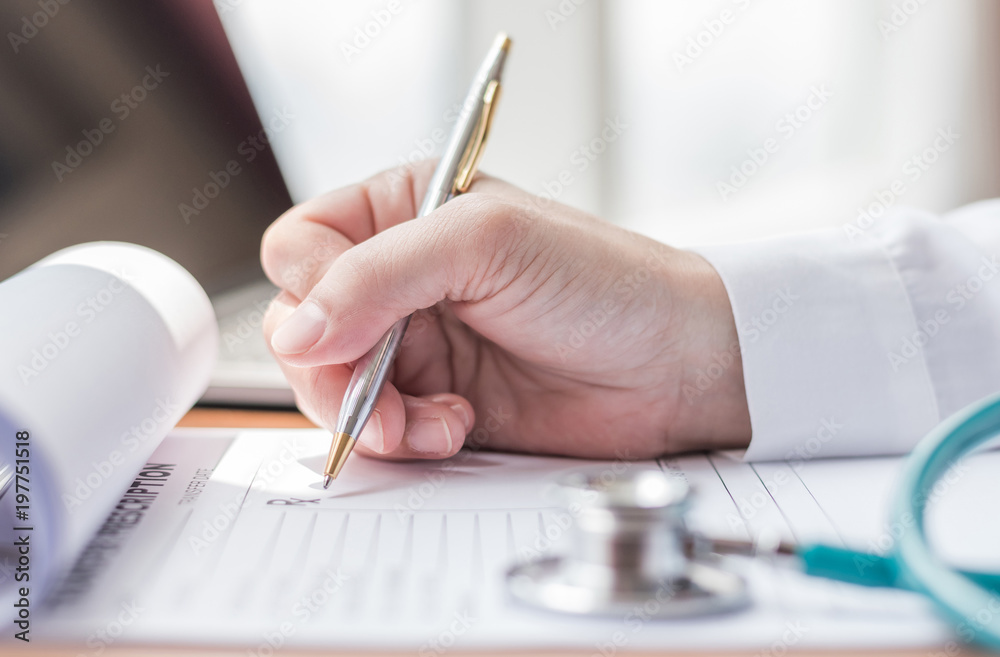 Physician doctor writing on medical health care record, patients ...