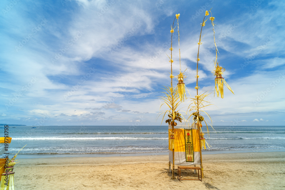 The penjor is a tall, curved bamboo pole decorated with coconut leaves ...
