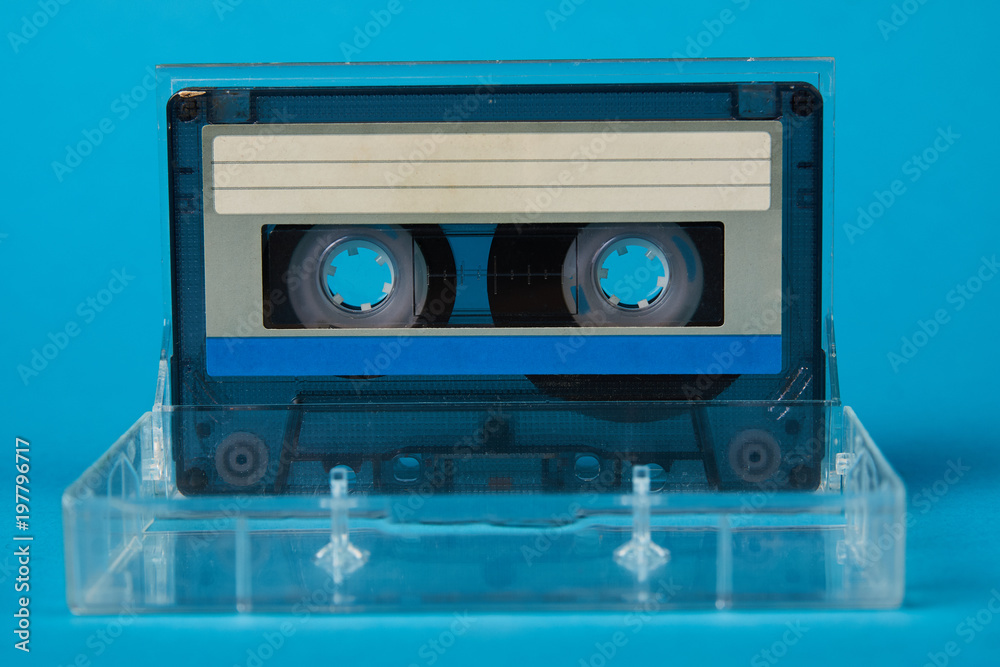 Blank cassette tape box on blue background. Vintage cassette tape case ...