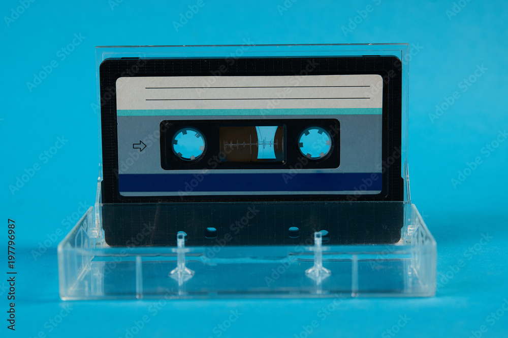 Blank cassette tape box on blue background. Vintage cassette tape case ...